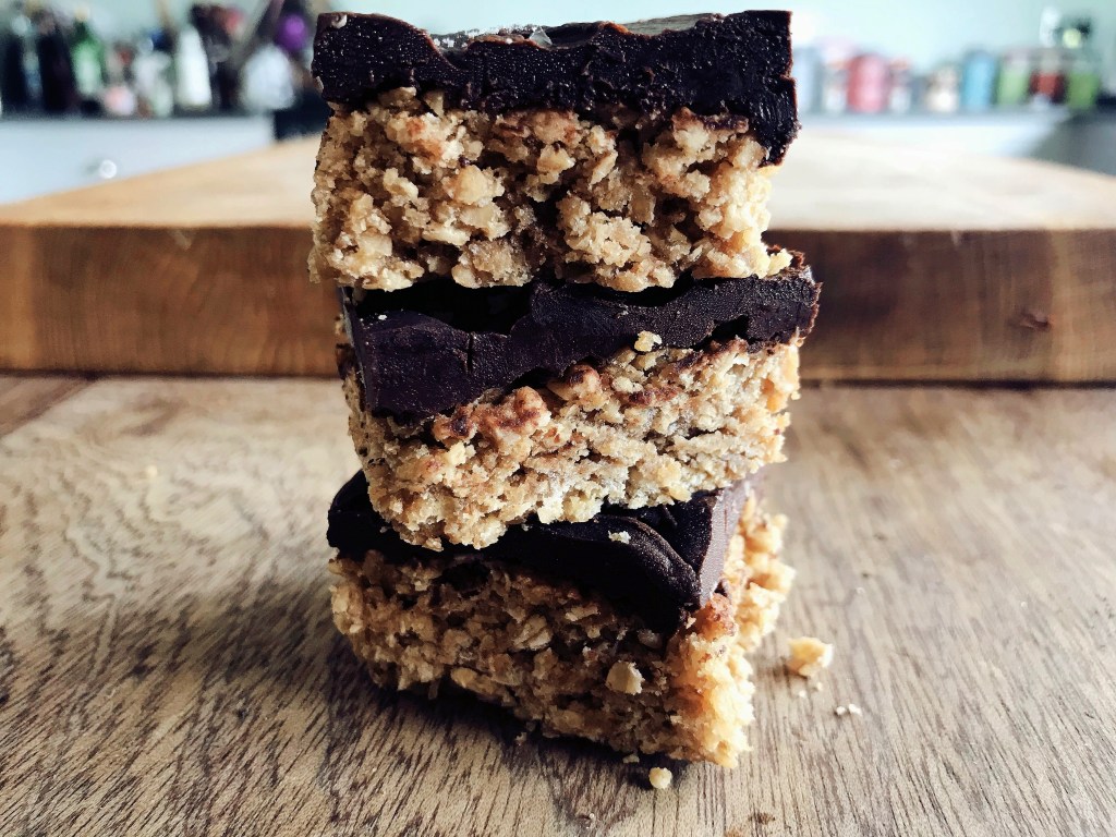 Chewy Banana Flapjacks with Chocolate Topping – AKitchenofGoodThings